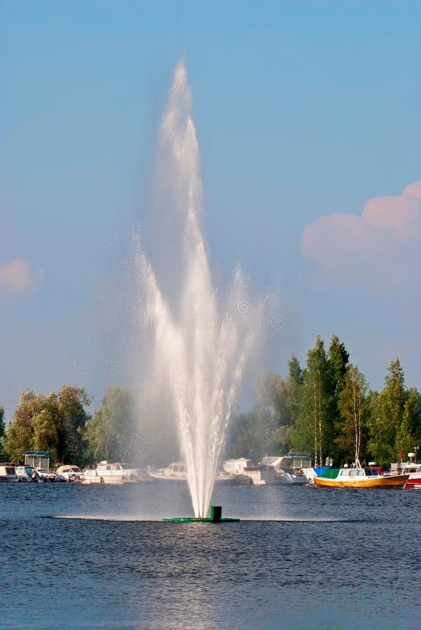 Fountain on the lake. stock photo. Image of clouds, splashes - 32644474