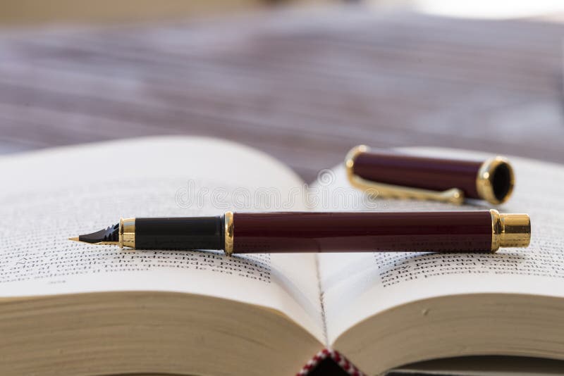 Fountain pen on book stock photo. Image of time, opened - 58340272