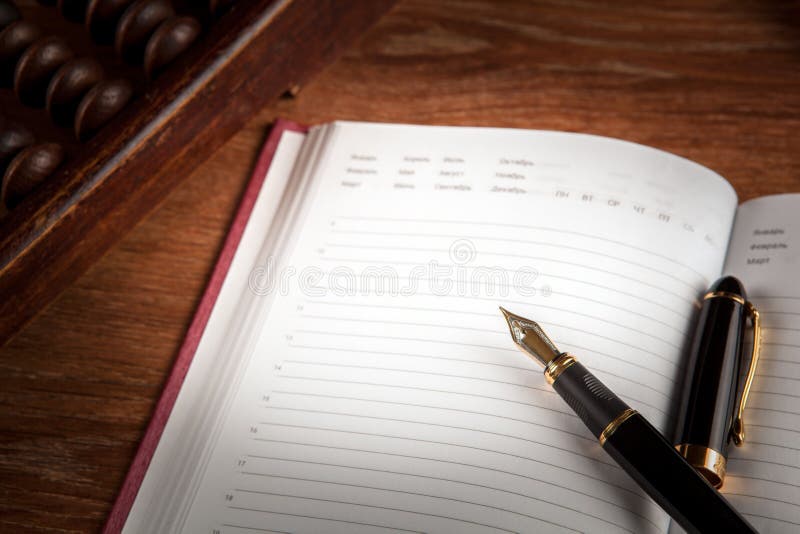 Fountain Pen and Diary on a Table with an Abacus Stock Photo - Image of ...