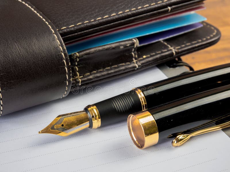 Fountain Pen and Notebook on Table Stock Photo - Image of busy, meeting ...