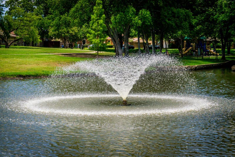 Fountain on Pond stock image. Image of bridge, tree, home - 41366179