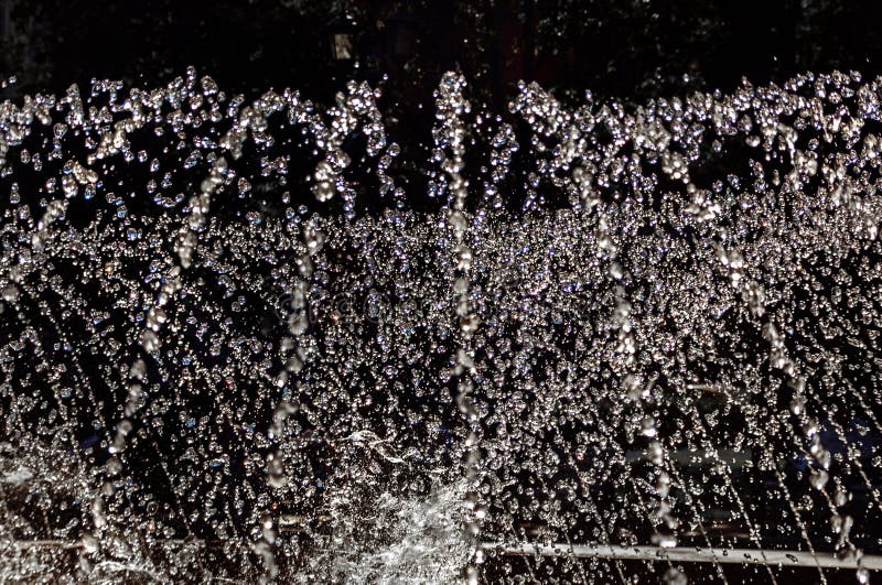 Fountain Splashes on Dark Background Stock Photo - Image of drop ...