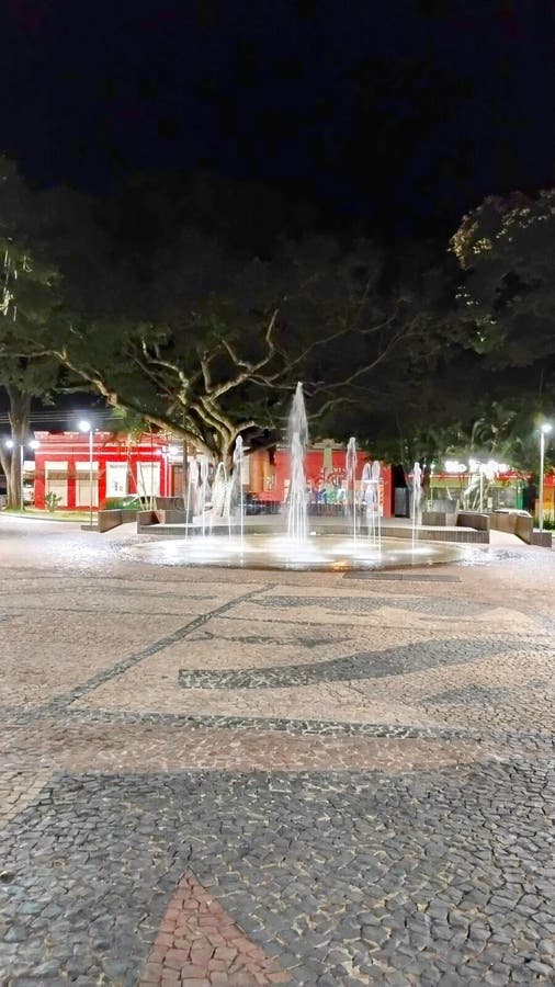 Fountain in the Square at Night Stock Image - Image of town, tree ...