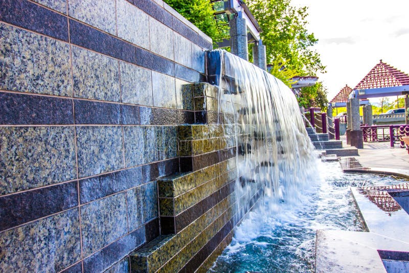 Fountain with Waterfall Over Stone Wall Stock Image - Image of reno ...