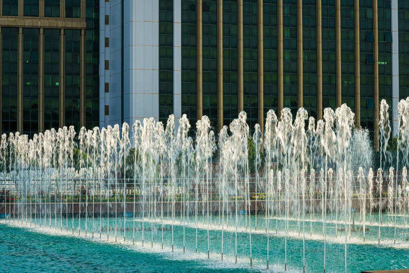 Fountains Illuminated by Sunlight at Sunset or Sunrise in the Park at ...