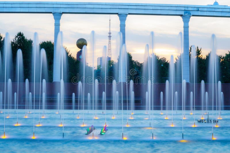 Fountains Illuminated by Sunlight at Sunset or Sunrise in the Park at ...