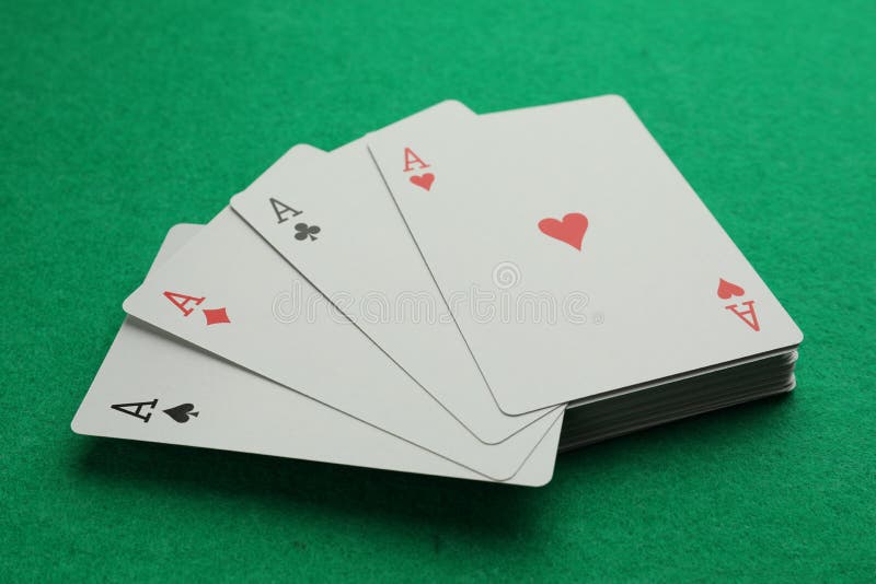 Four Aces Playing Cards on Green Table, Closeup. Poker Game Stock Image ...