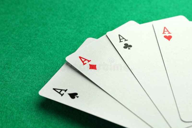Four Aces Playing Cards on Green Table, Closeup. Poker Game Stock Image ...