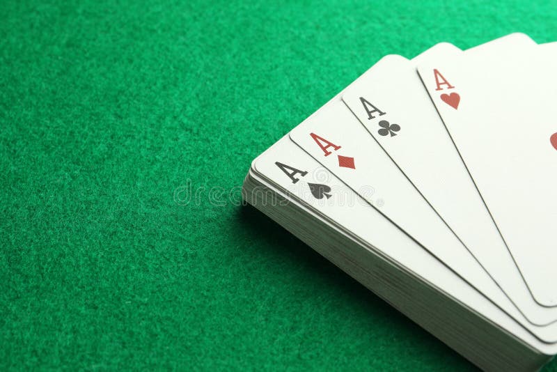 Four Aces Playing Cards on Green Table, Closeup. Space for Text Stock ...