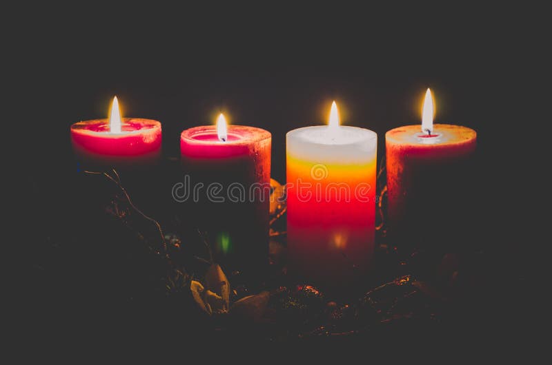 Four Advent Candles Burning on Black Background Stock Photo - Image of ...