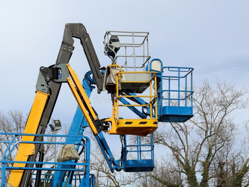 Aerial Working Platforms of Cherry Picker Against Blue Sky with Clouds ...