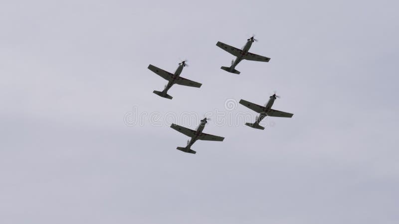 Four Aerobati Planes Do a Loop in Diamond Formation with Mountains As ...