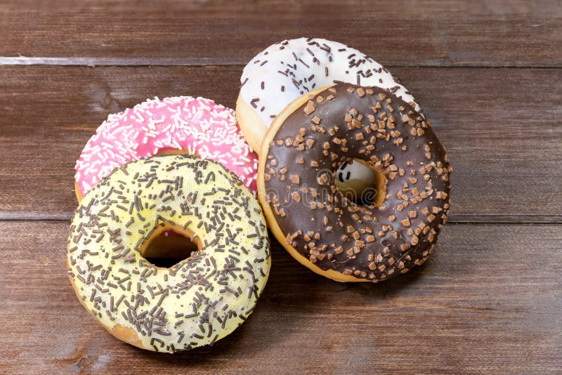 Four American Donuts on a Desk Stock Photo - Image of hungry ...