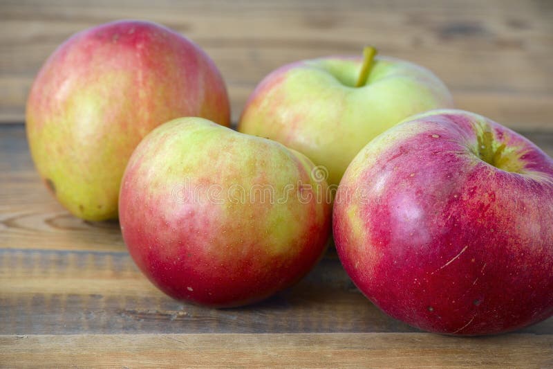 Four apples stock photo. Image of wooden, apple, organic - 27249954