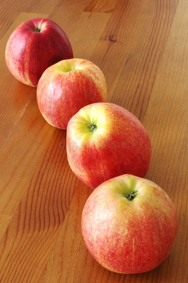 Four apples on the table stock photo. Image of fruit - 13471772