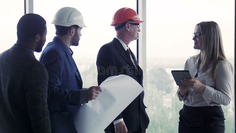 Four Architects Discussing Building Plan Stock Footage - Video of ...