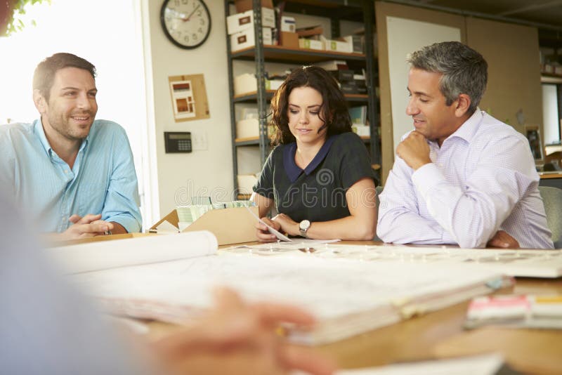 Six Architects Sitting Around Table Having Meeting Stock Photo - Image ...