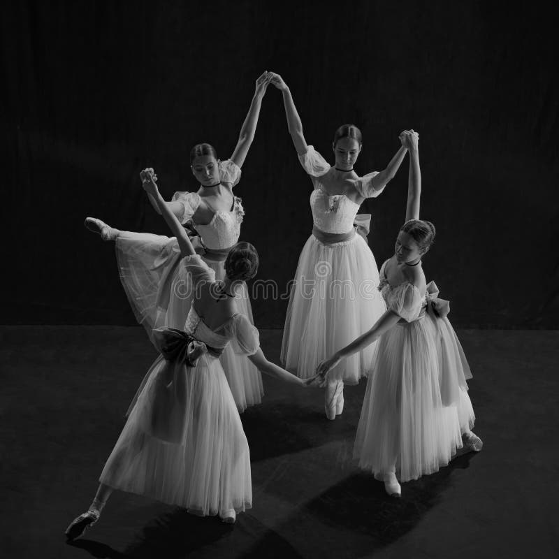 Four Ballerinas Hold Hands As they Perform Delicate Ballet Pose Race ...
