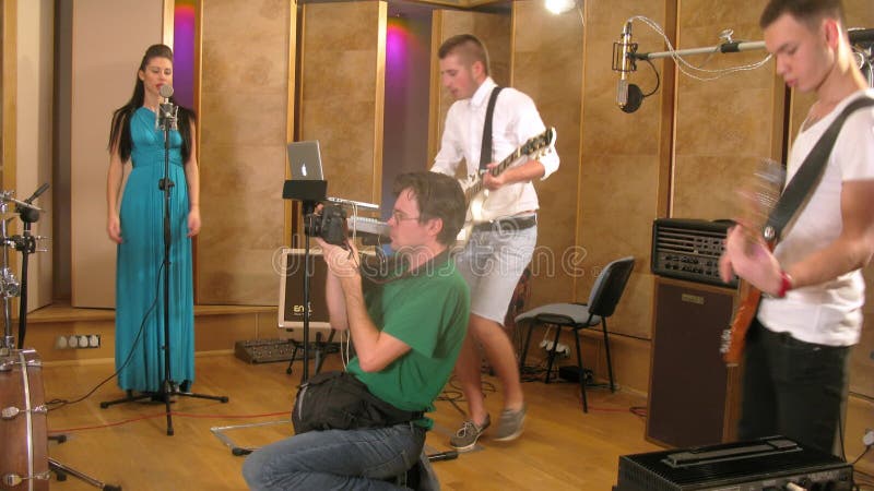 Four Band Members Rehearsing in Studio and Stock Footage - Video of ...