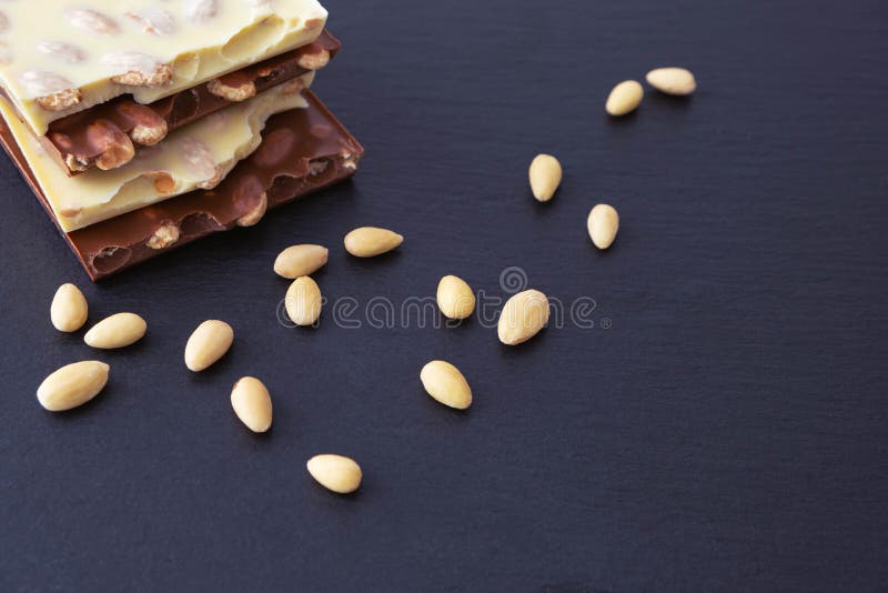Four Bars of White and Milk Chocolate with Almonds Stock Photo - Image ...