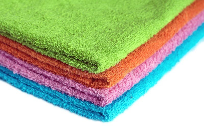Four Bath Towels of Different Colors Stacked Isolated Stock Photo ...