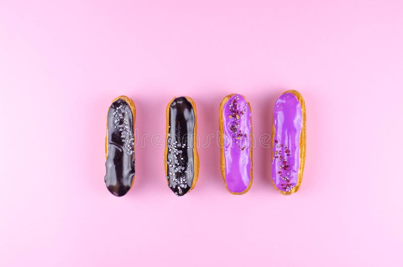 Four Beautiful and Delicious Eclairs on a Pink Background. Stock Photo ...
