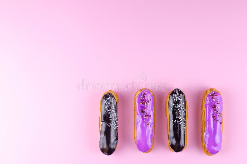 Four Beautiful and Delicious Eclairs on a Pink Background. Stock Photo ...