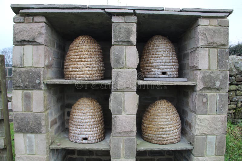 Four Behives in a Stone Structure Stock Image - Image of shelves, stone ...