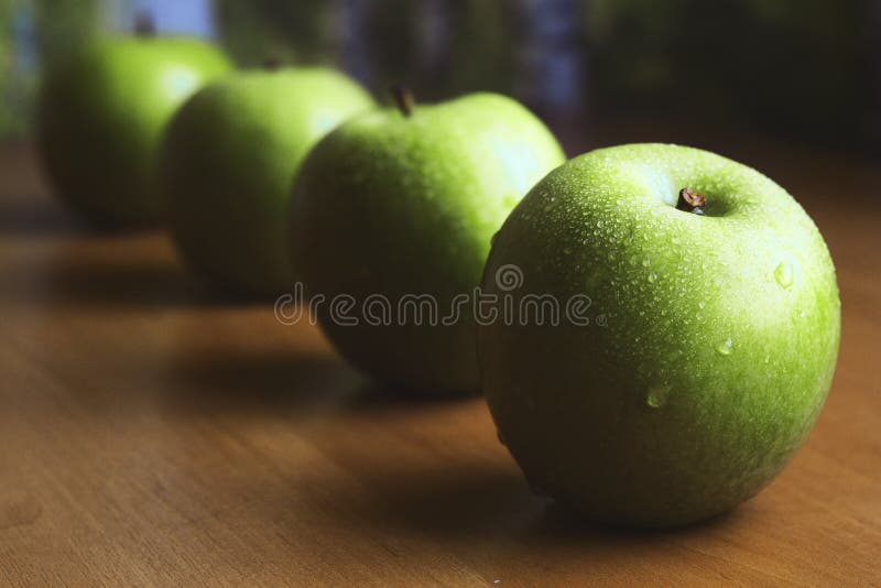 Four big green apples stock image. Image of backgrownds - 45139505