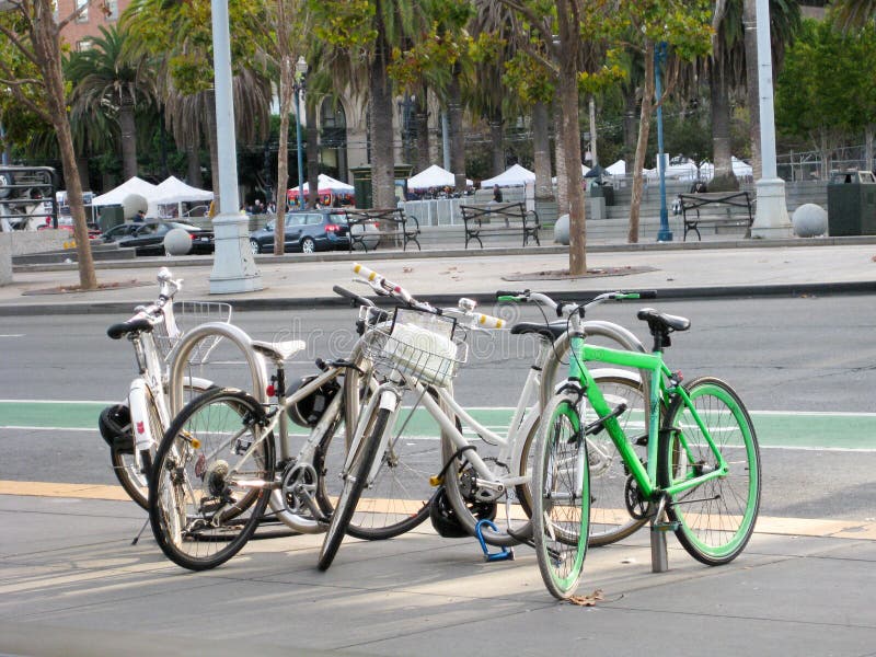 Four Bikes Parked at Street Stock Photo - Image of cycling, parked ...