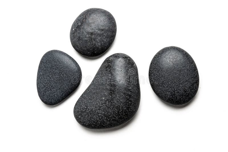 Four black pebbles stock image. Image of nature, four - 185667135