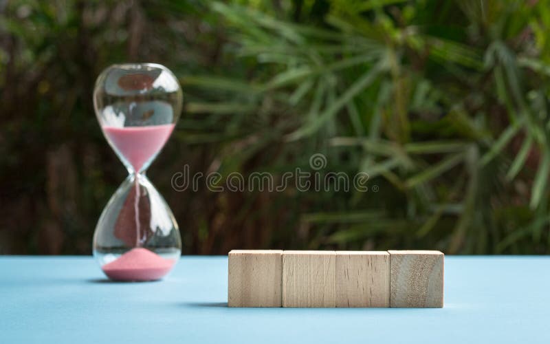 Four Blank Wood Toy Blocks in a Row Next To Sand Timer Stock Image ...