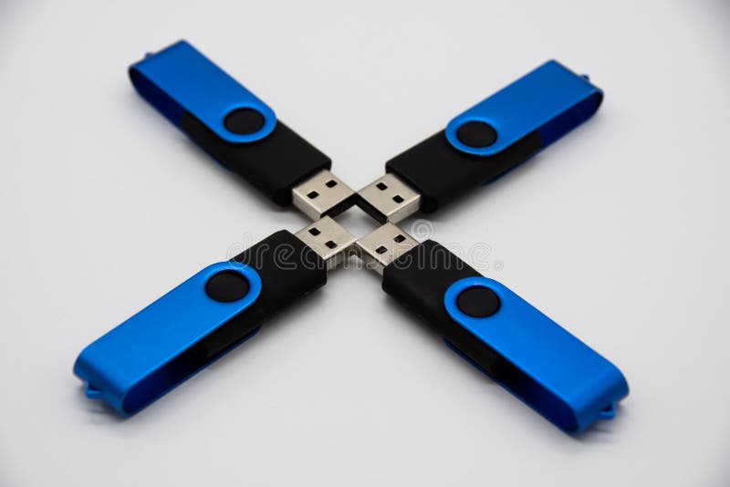 Four Blue Black USB Sticks in a Formation on a White Background Stock ...