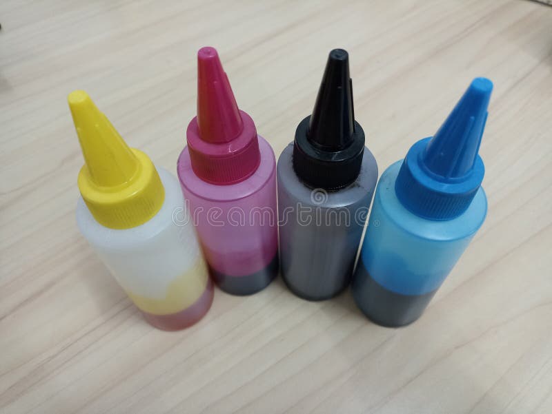 Four Bottles of Printer Ink Stock Photo - Image of purple, blue: 258343782
