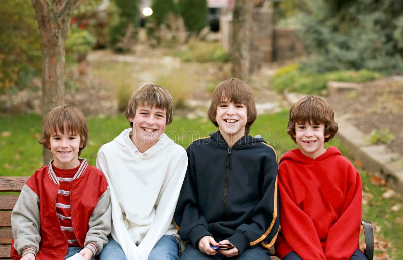 Four Boys Smiling stock photo. Image of outdoor, brother - 6309526