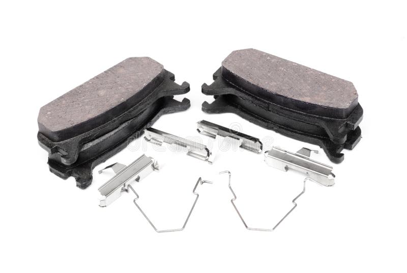 Four brake pads and spring stock image. Image of gray - 30726739