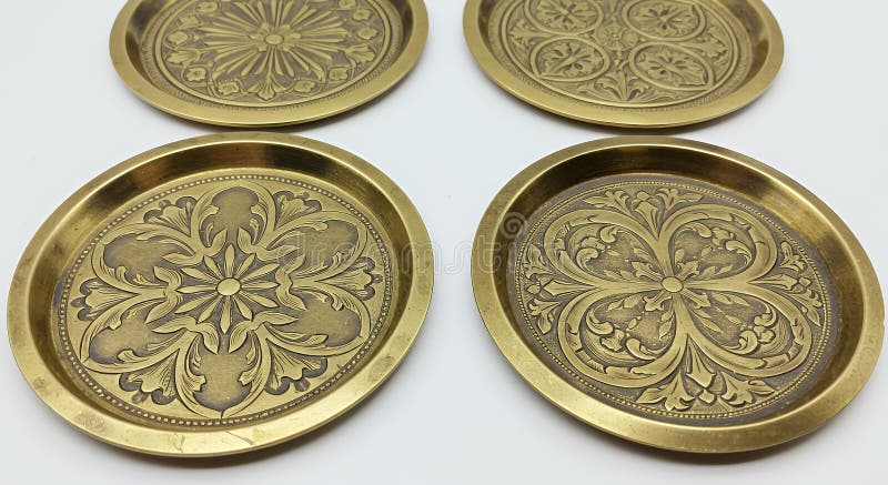 Intricate Etched Brass Coasters Set on White Background Stock ...