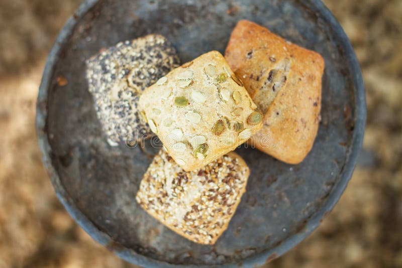 Breads on a rustic plate stock photo. Image of rustic - 153907824