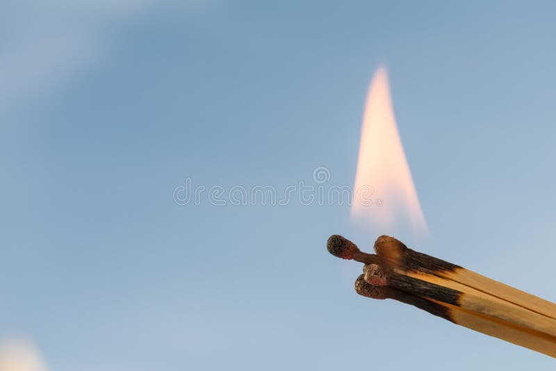 Four Burning Matches on a Blue Background Stock Image - Image of burnt ...