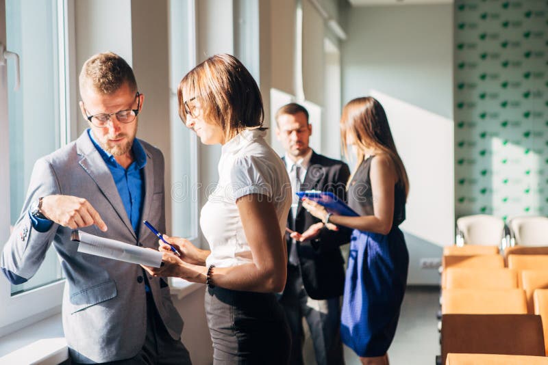 Four Business Man Discussing Work in the Office Stock Image - Image of ...