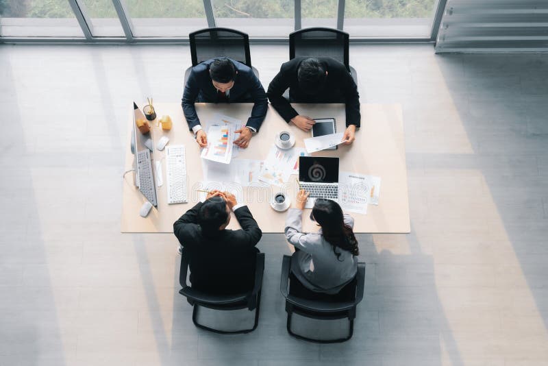Four Business People Having Meeting Together in Office Stock Photo ...