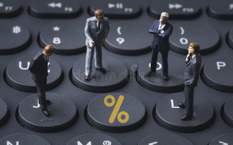 Four Businessmen Standing and Thinking on Computer Keyboard with ...