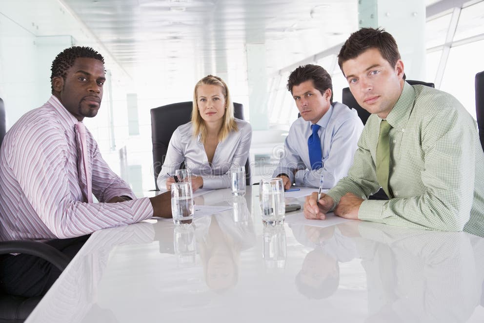 Four Businesspeople in a Boardroom Stock Photo - Image of american ...