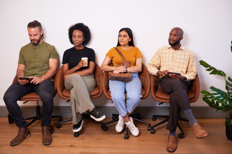 Four Candidates Sitting in a Row Waiting for Job Interview, Creative ...