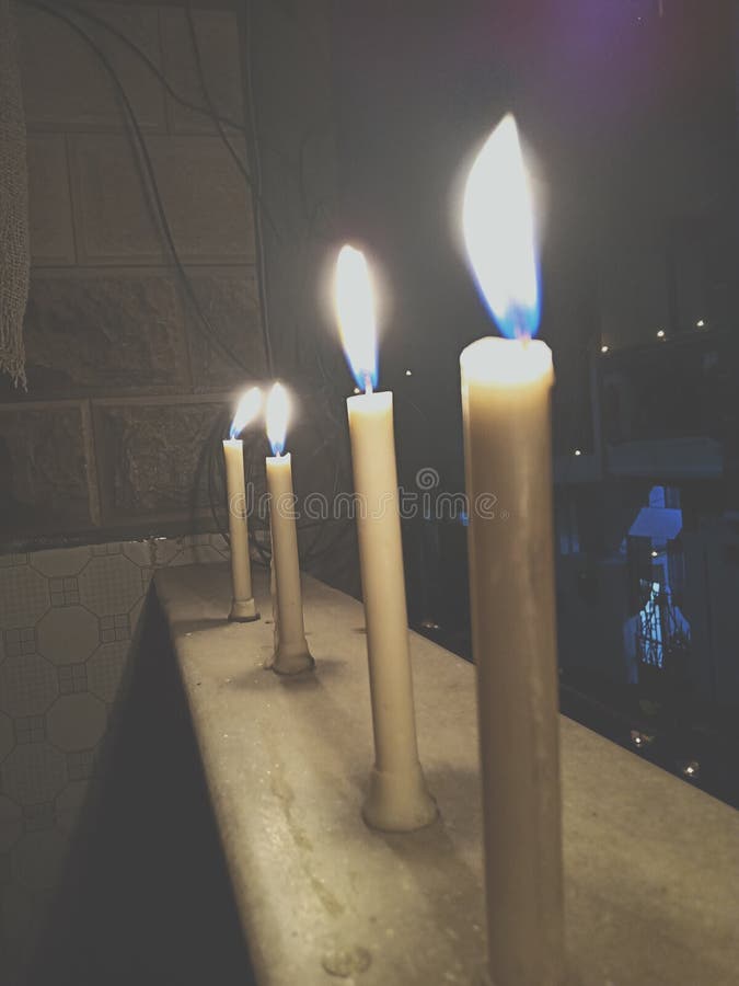 Four candles in night stock photo. Image of candles - 178134636