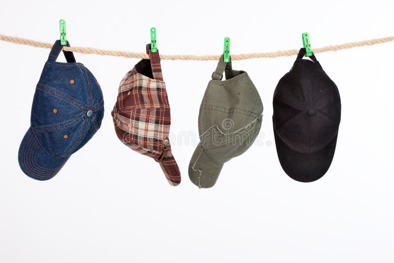 Four Caps on a Clothesline stock photo. Image of colour - 10597442