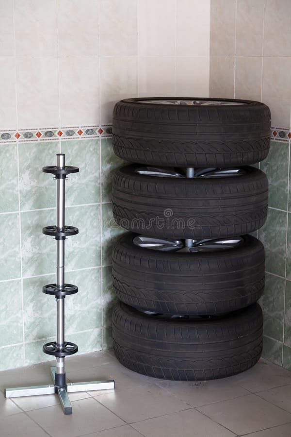 Four Car Wheels Stand Vertically in Corner of Garage Stock Photo ...