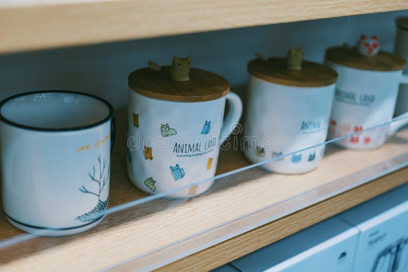 Four Ceramic Mug With Caps stock image. Image of indoors - 109909573