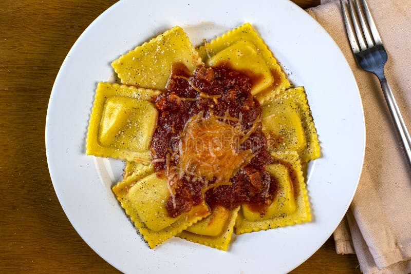 Four Cheese Ravioli Top with Sauce and Melted Cheese Stock Photo ...