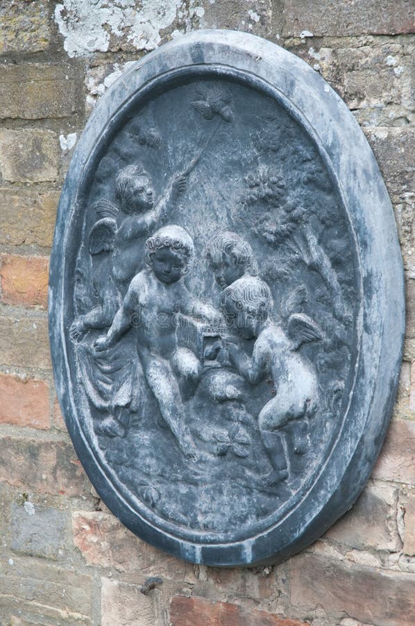Cherubs Playing with Nature in an Antique Bas-relief Sculpture on a ...